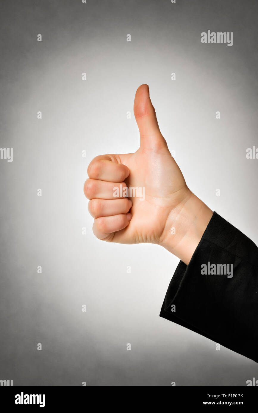 Image of a right hand with thumb up of a businesswoman Stock Photo - Alamy