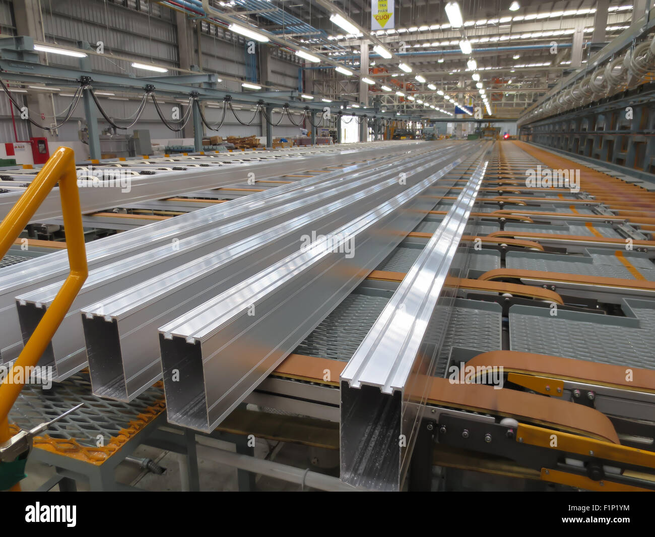 Aluminum lines on a conveyor belt in a factory Stock Photo - Alamy