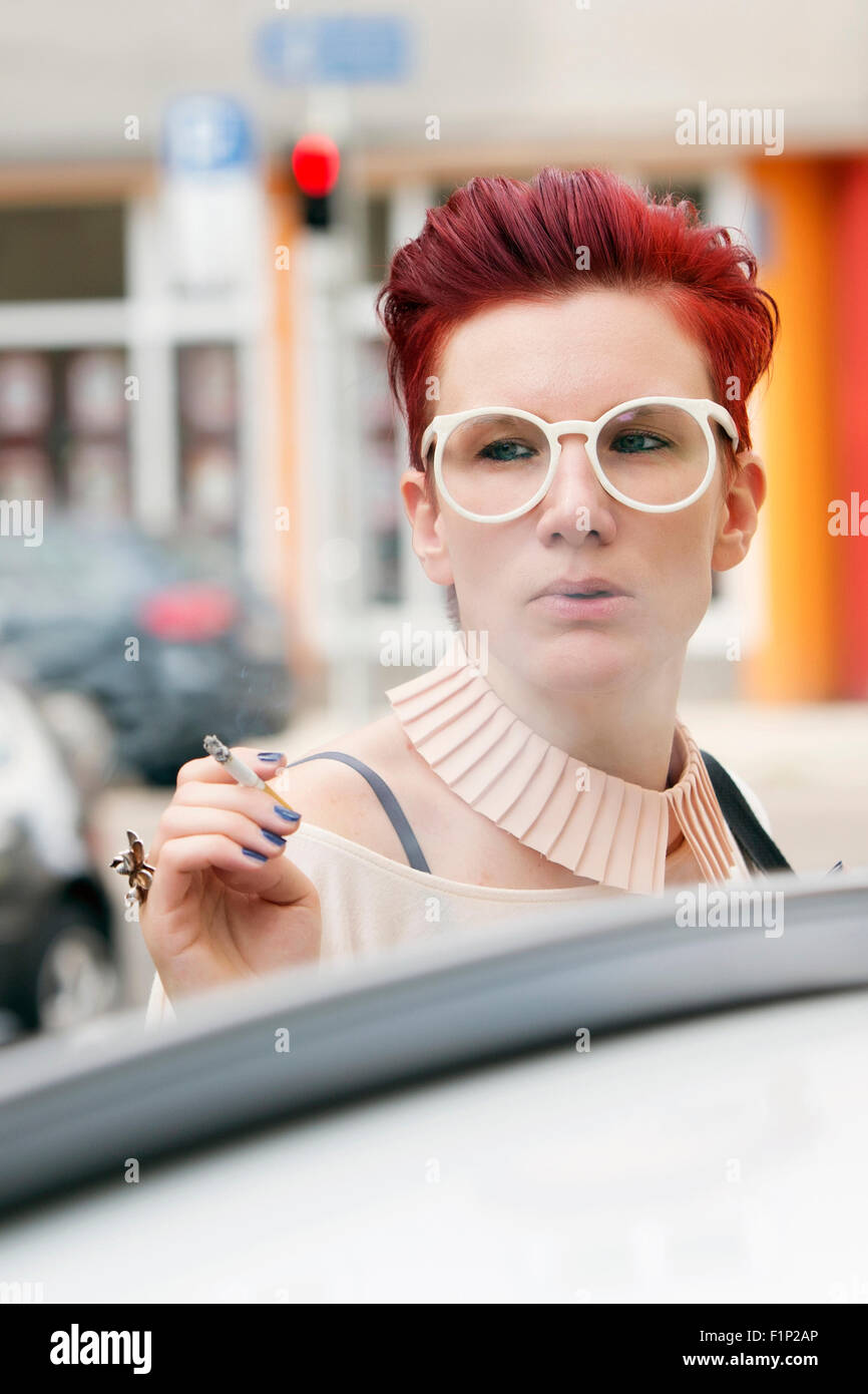 Beautiful redhead woman smoking cigarette hi-res stock photography and images - Alamy