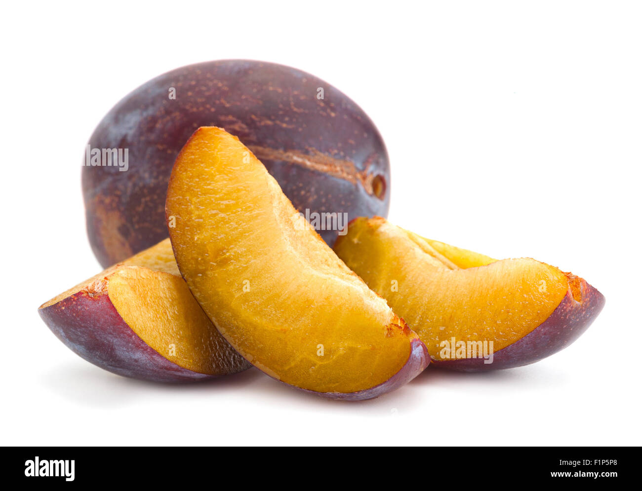 Plum fruit slice closeup isolated on white Stock Photo - Alamy