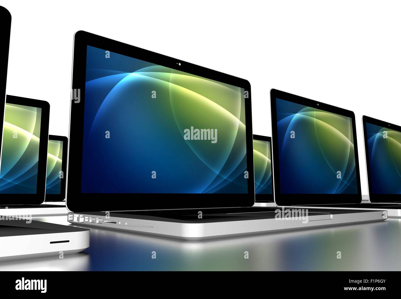 School Laptop Computers. Many Laptops on the Big Desk. Solid White ...