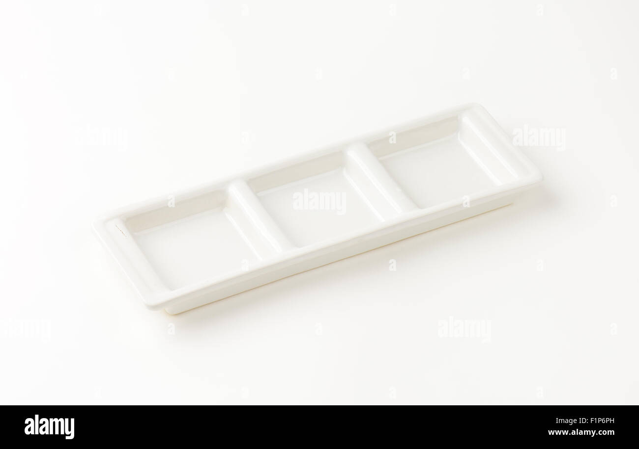 empty white tray on white background Stock Photo - Alamy
