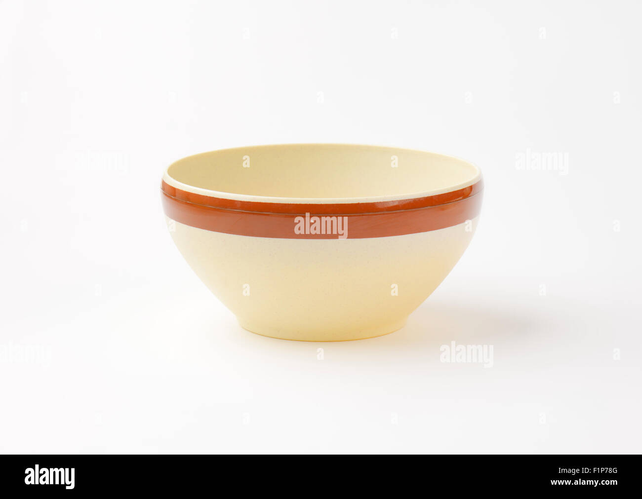 beige bowl with brown stripe on white background Stock Photo - Alamy
