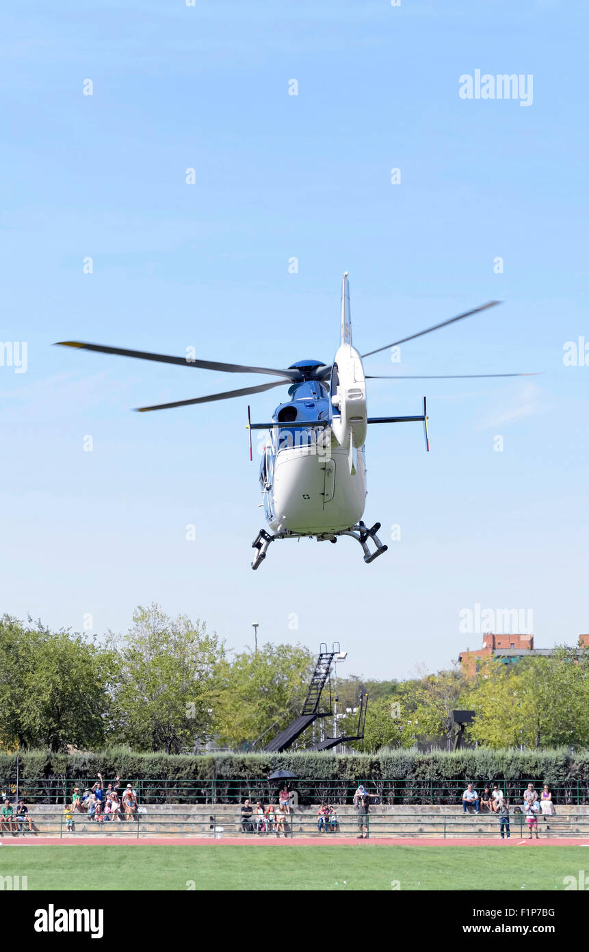 Rear view. Helicopter, of spanish police, is taking off with ...