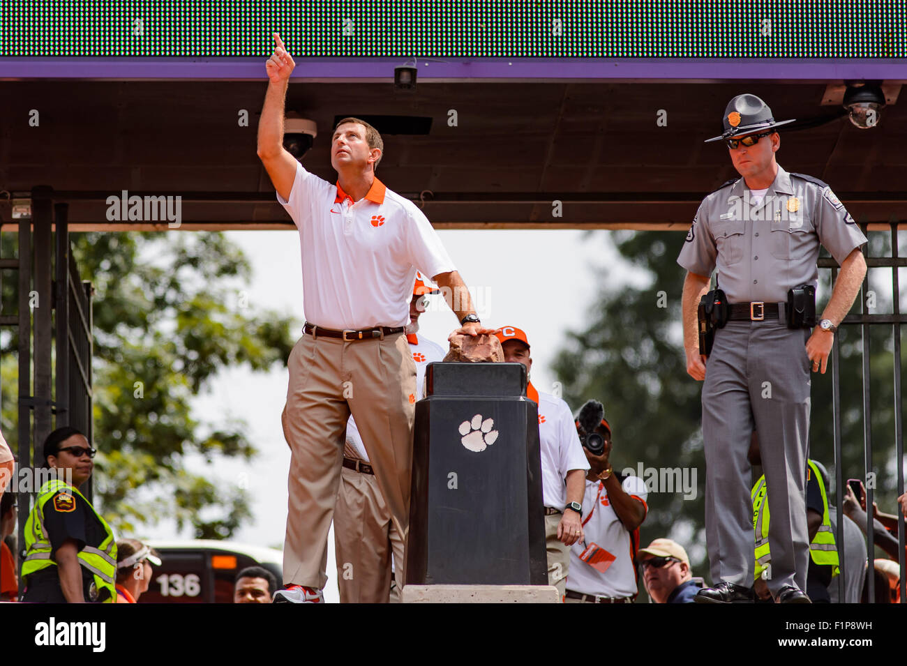 Clemson Tigers head coach Dabo Swinney enters the stadium at the top of ...