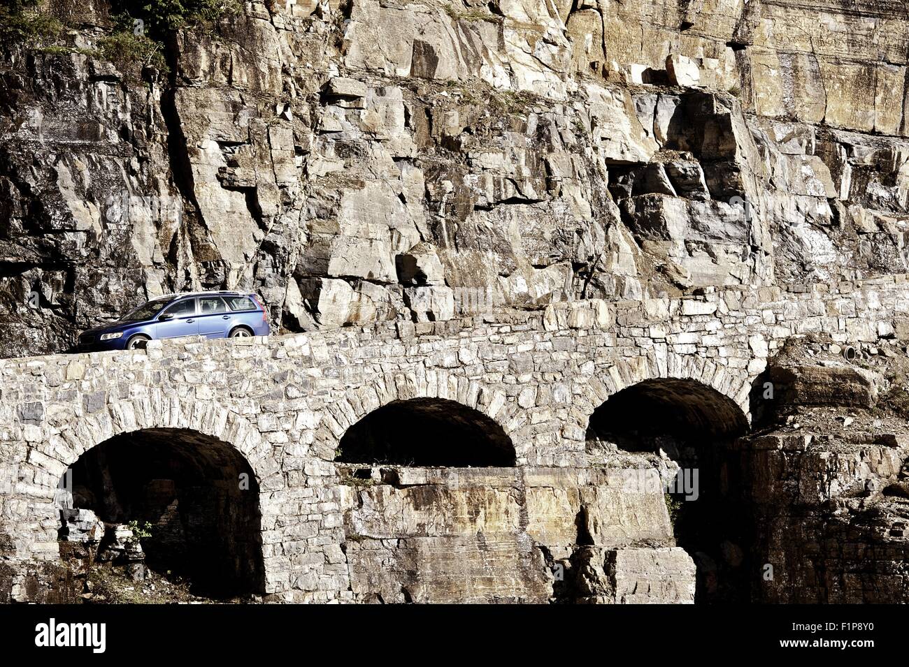 Mountain Bridge and Blue SUV Car. Road-to-the-Sun Glacier National Park ...