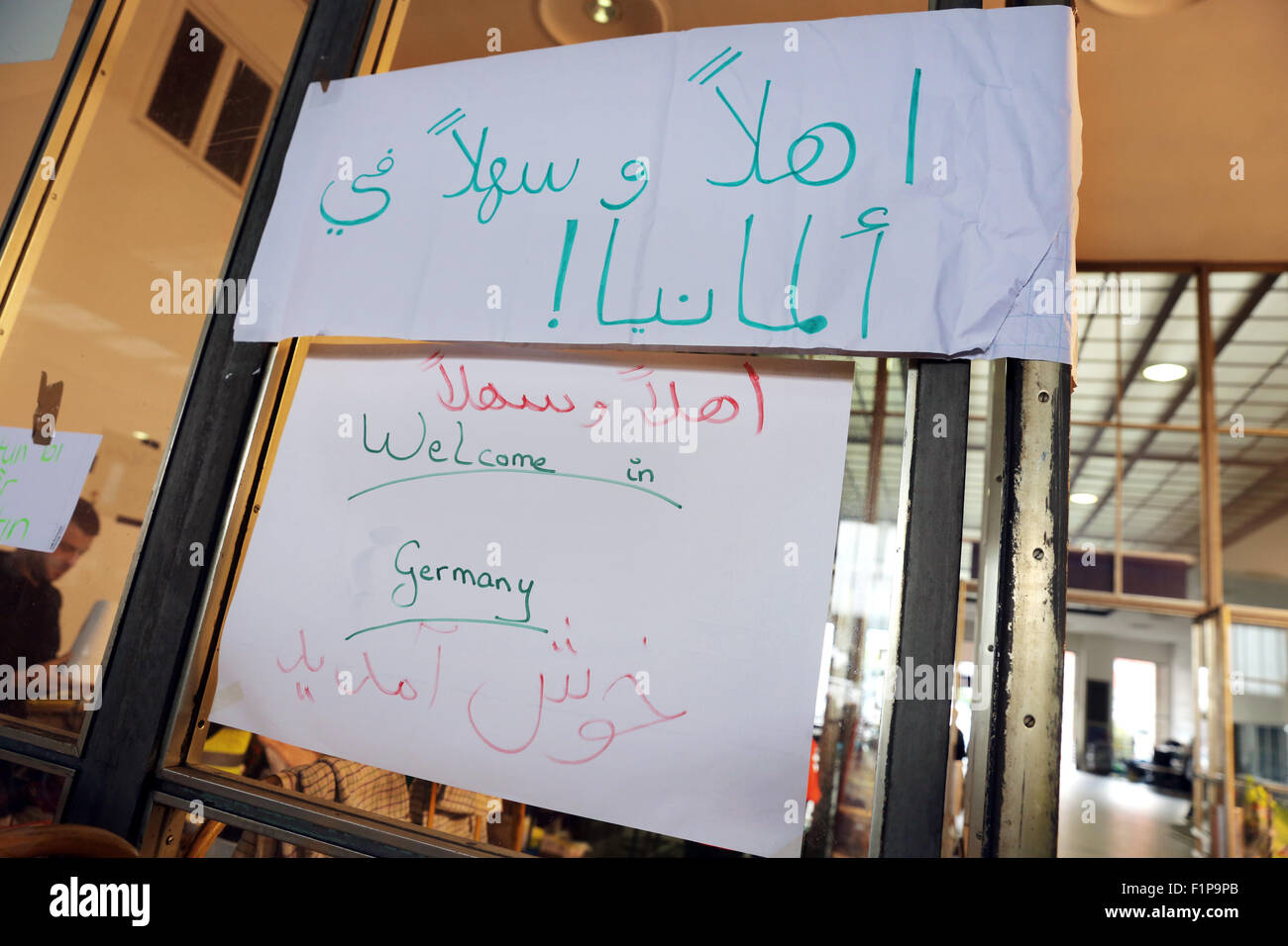 A hand-written sign says "Welcome in Germany" at a migrants ...