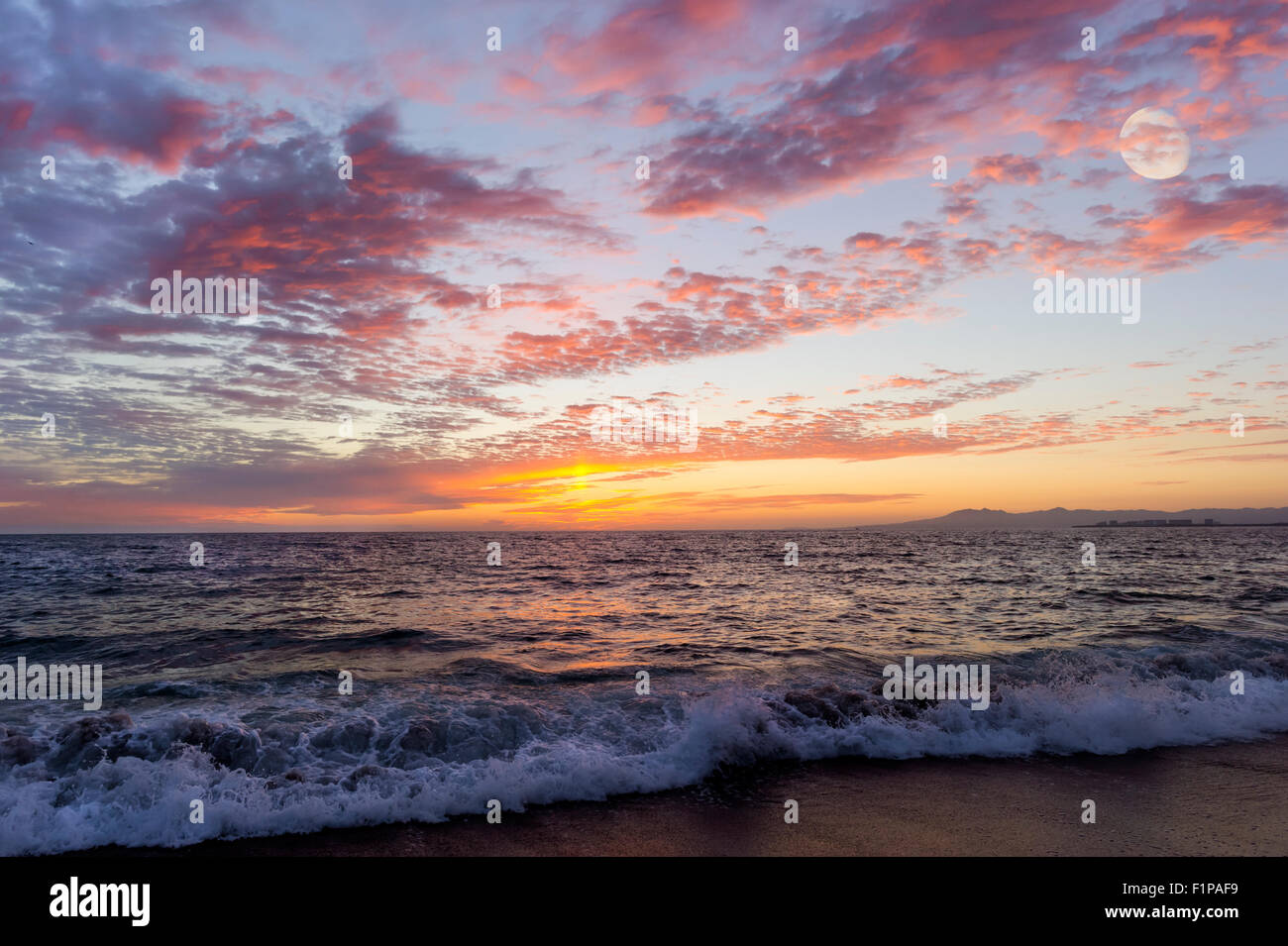 Beach sunset moon is a color ocean sunset with the waves rolling to ...