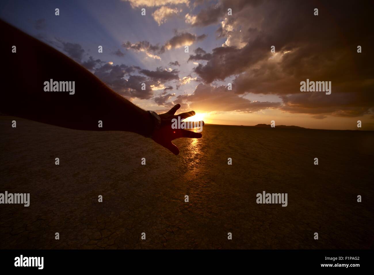 To The Sun - Male Hand Trying to Cover the Sun Stock Photo - Alamy