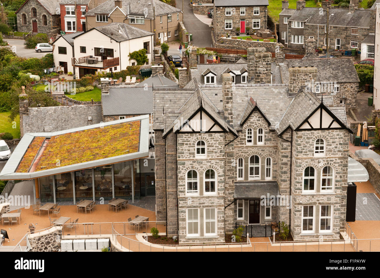 The new Harlech Castle visitor center and its cafe with a grass roof ...