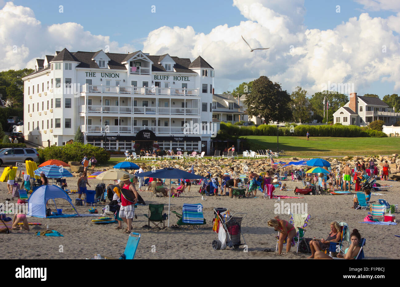 The Union Bluff Hotel in York, Maine, with sunbathers on the beach ...