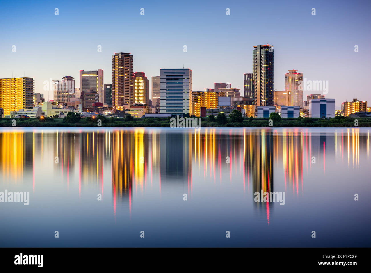 Osaka, Japan skyline at the Umeda District on the Yodogawa River Stock ...