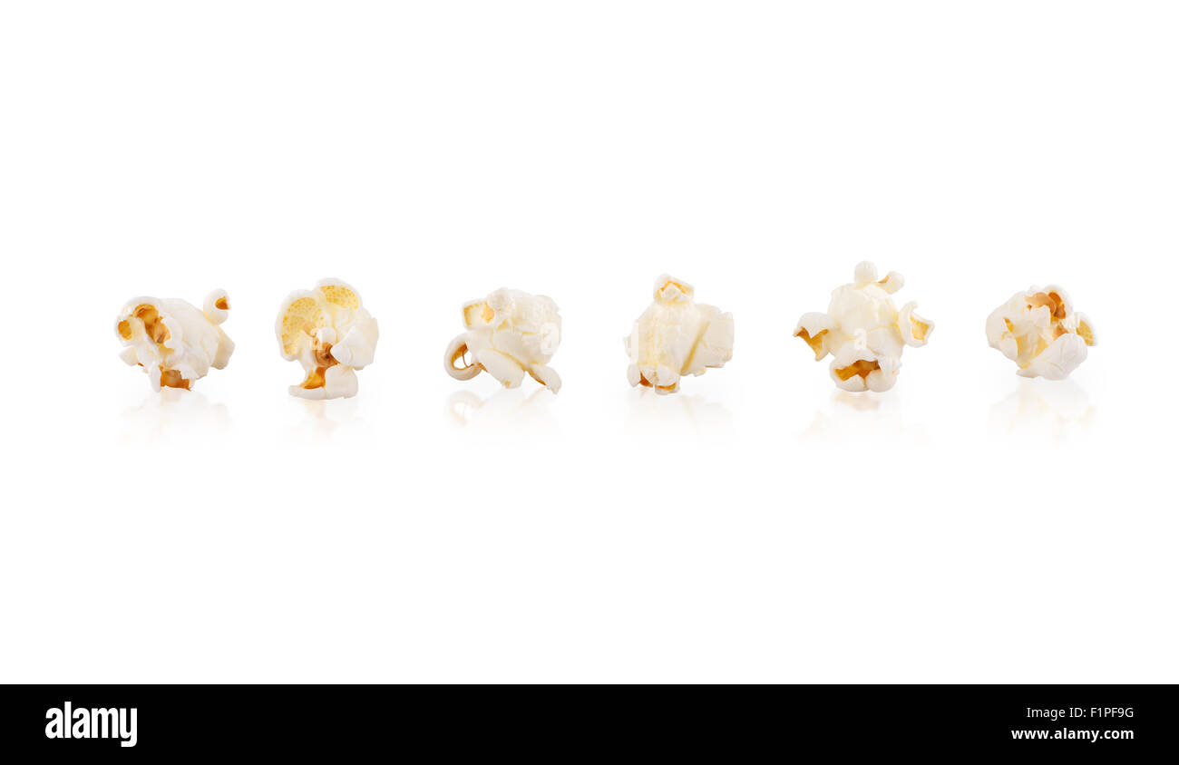 Popcorn spread and arranges on white background Stock Photo - Alamy