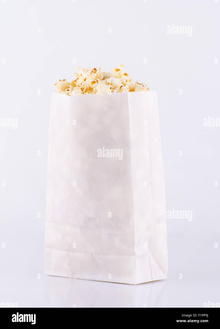Popcorn in paper bag isolated on white background Stock Photo - Alamy