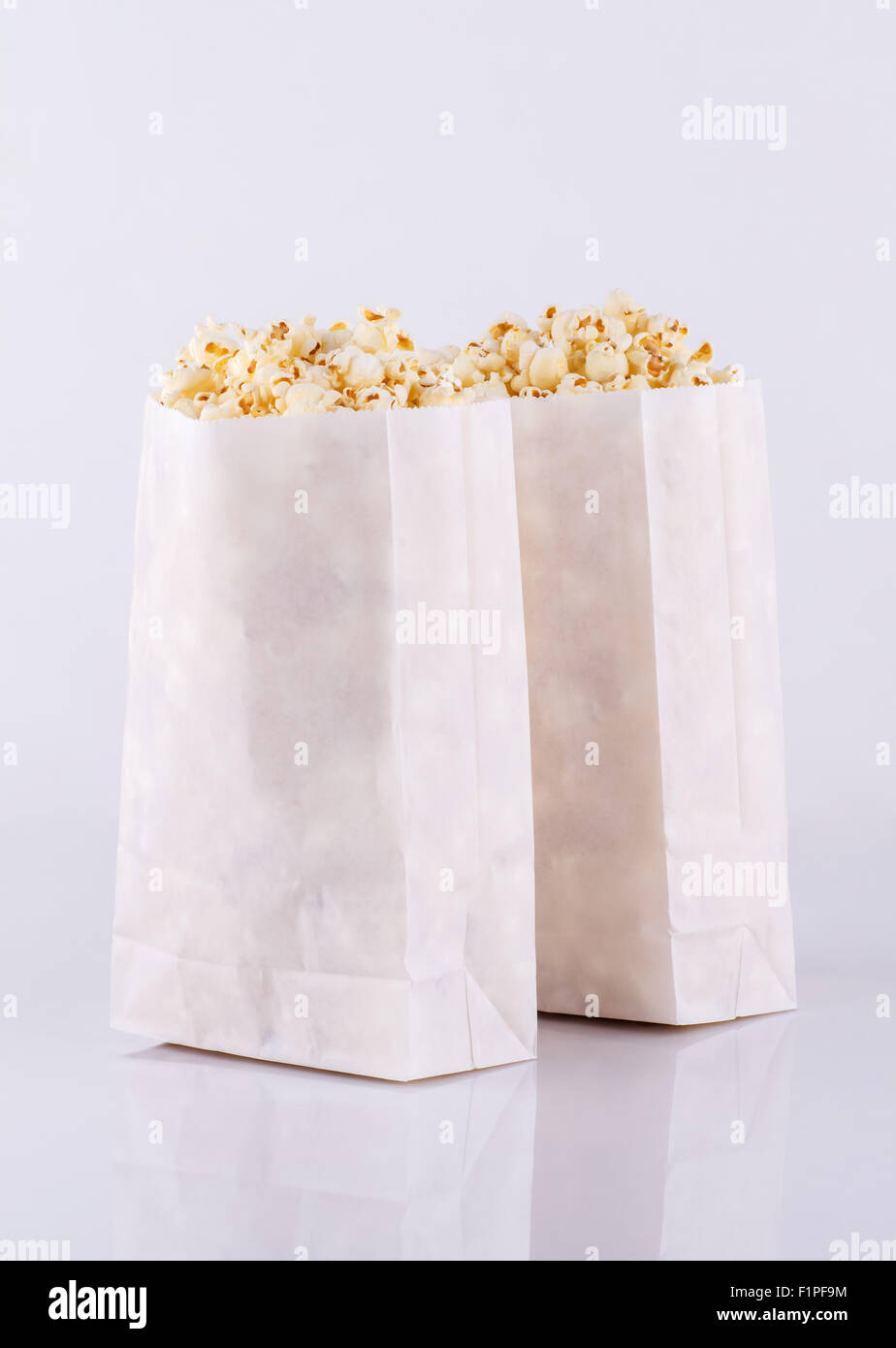 Popcorn in paper bags isolated on white background Stock Photo - Alamy