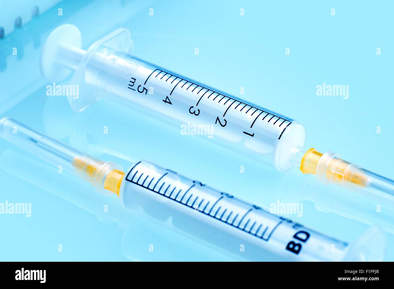 Two Plastic Syringes at Doctor Desk. Health and Beauty Photo Collection ...