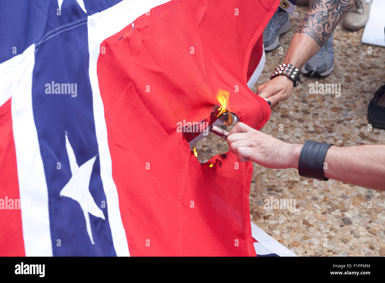 Protesters burning an america flag us hi-res stock photography and ...