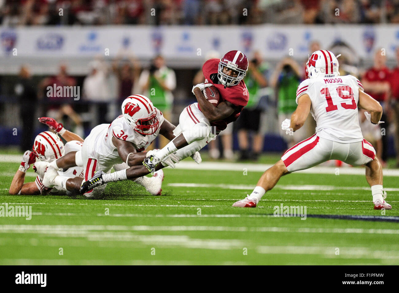 Alabama receiver Robert Foster (8) eyes Wisconsin defensive back Leo ...