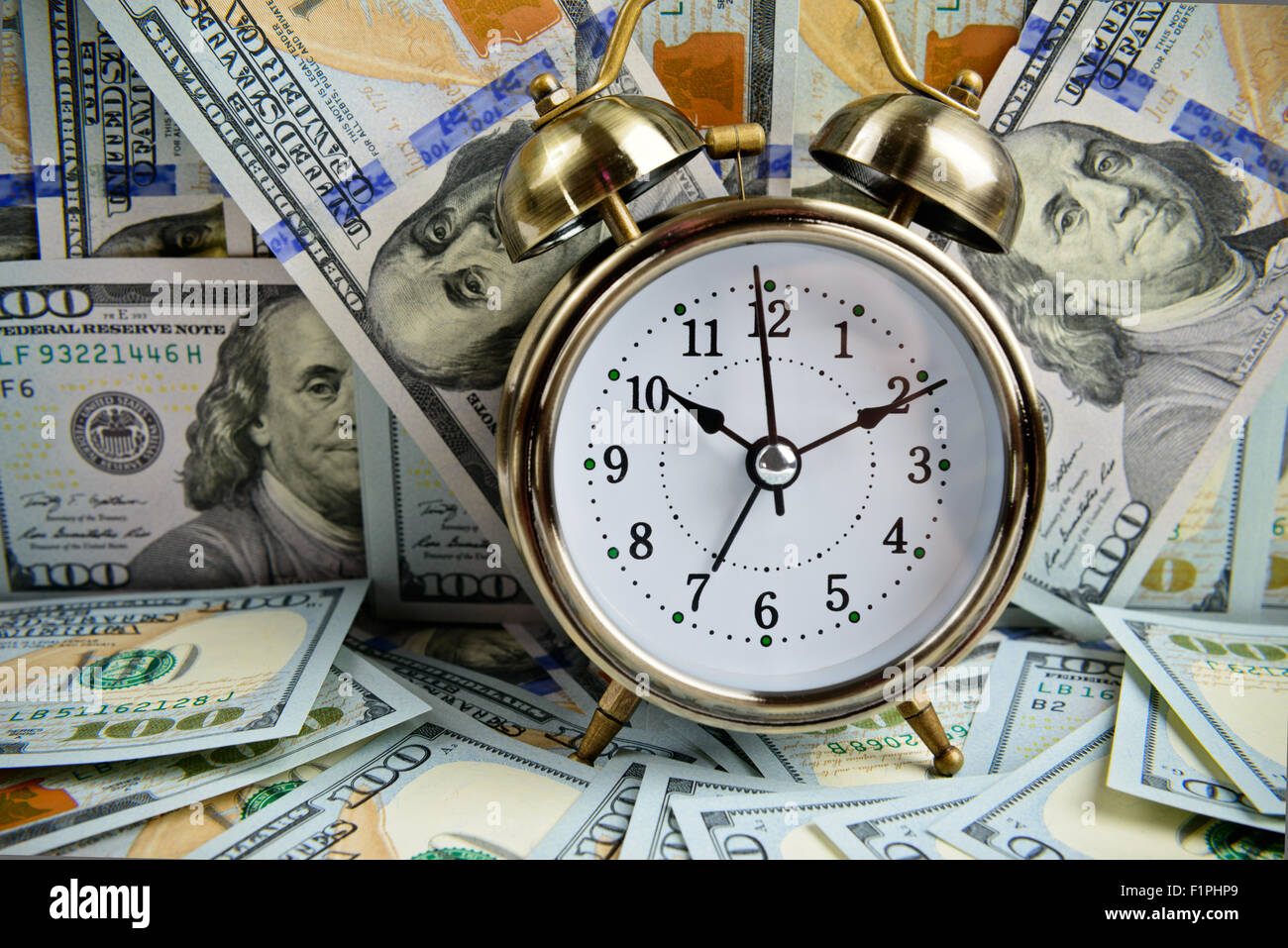 Vintage alarm clock over money Stock Photo - Alamy Vintage alarm clock over money Stock Photo - Alamy
