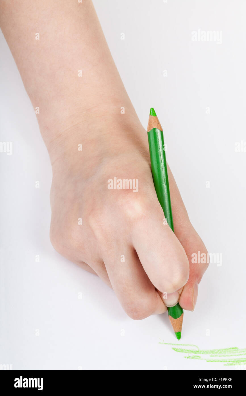 hand draws by green crayon on sheet of paper isolated on white ...
