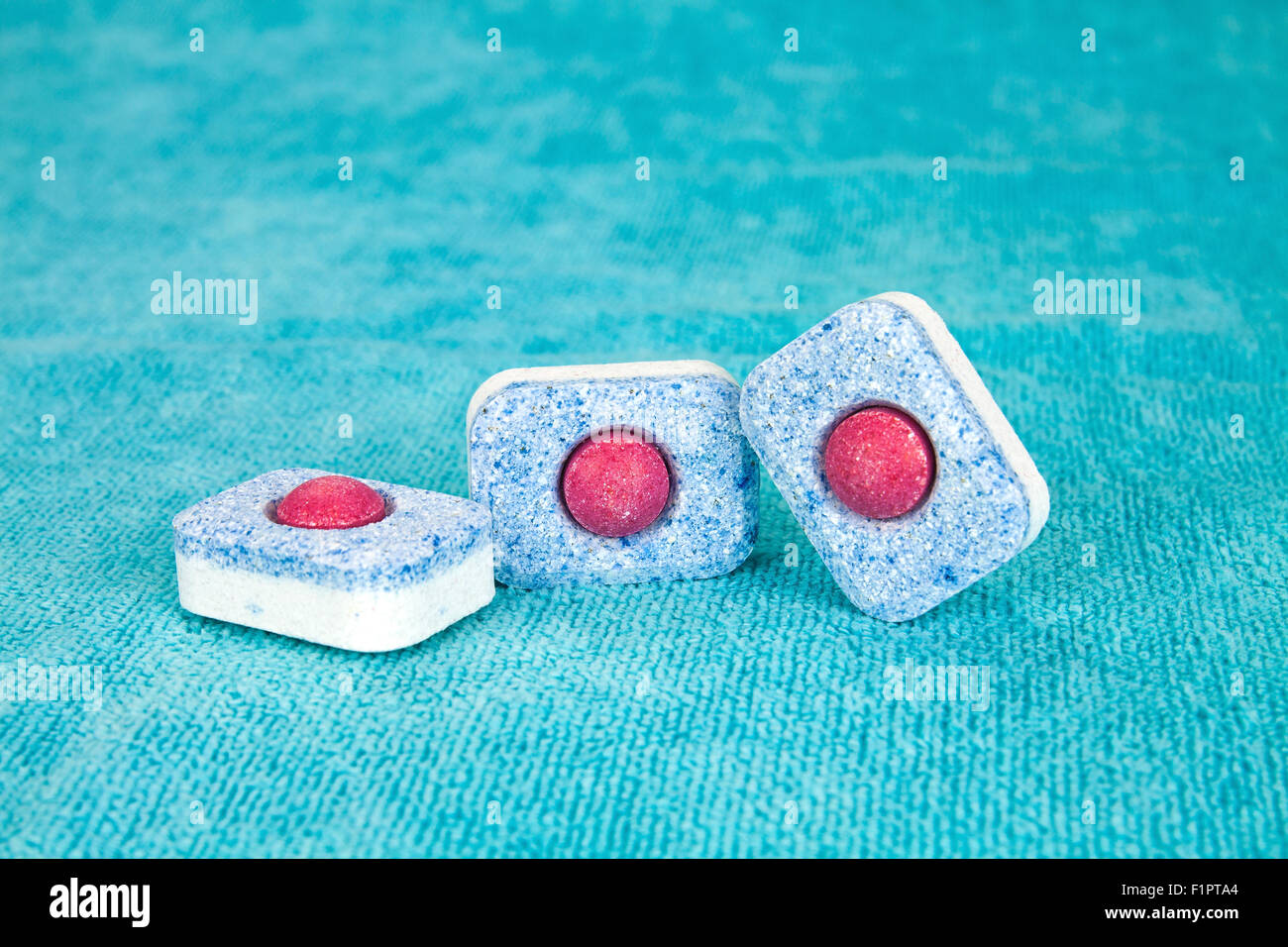 Group of three modern chemical tablets for dishwasher Stock Photo - Alamy