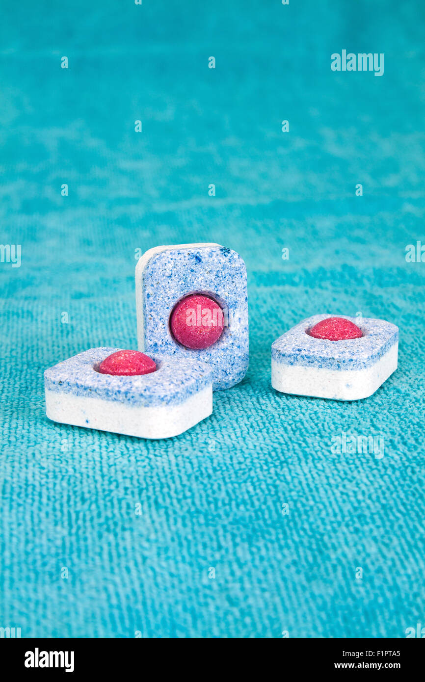 Group of three modern chemical tablets for dishwasher Stock Photo - Alamy