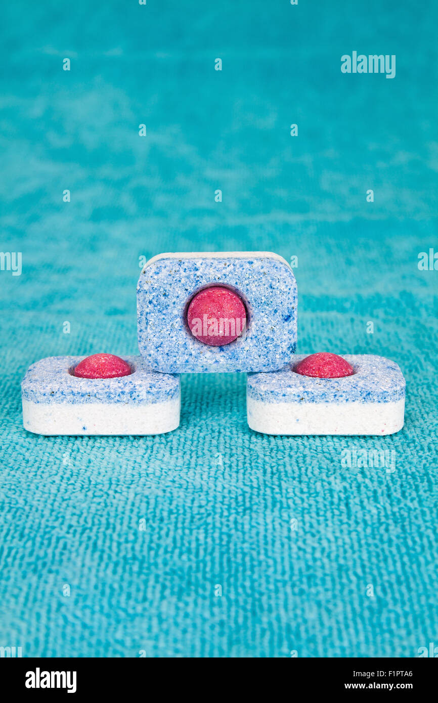 Group of three modern chemical tablets for dishwasher Stock Photo - Alamy
