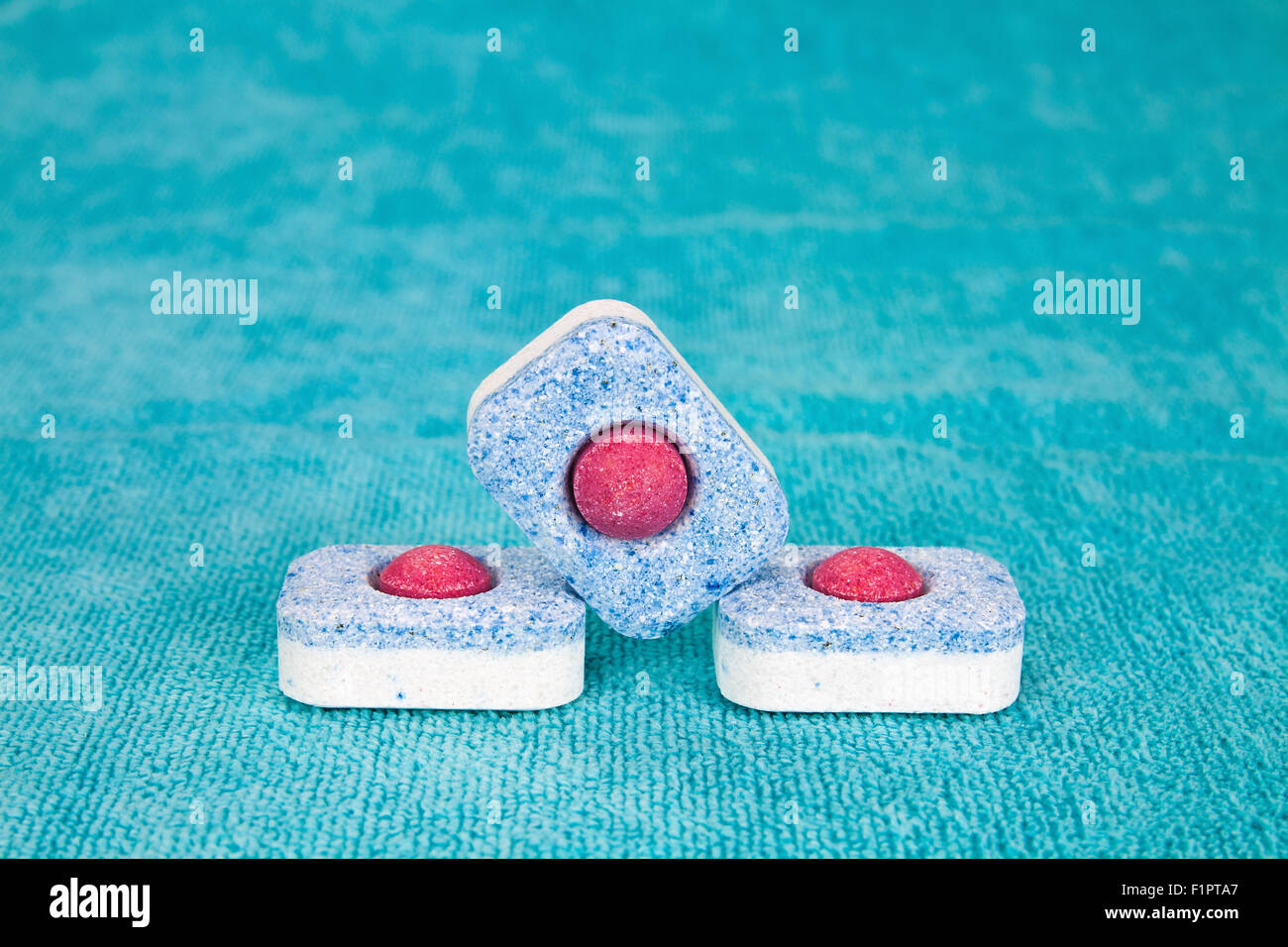 Group of three modern chemical tablets for dishwasher Stock Photo - Alamy