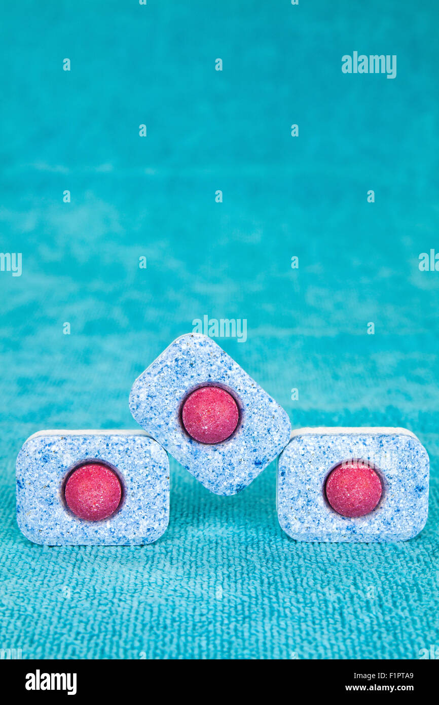 Group of three modern chemical tablets for dishwasher Stock Photo - Alamy