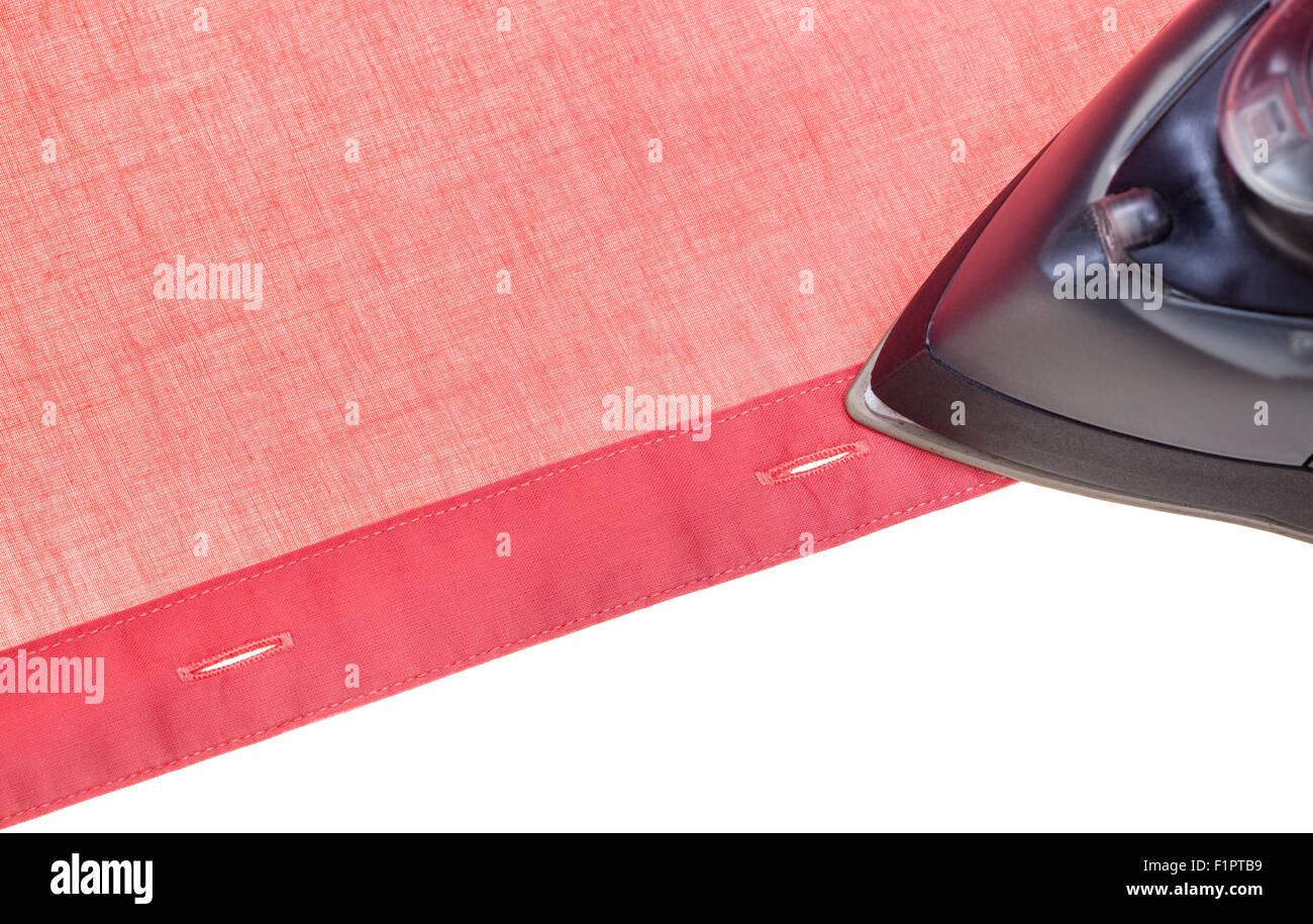 above view of black iron ironing red shirt isolated on white background ...
