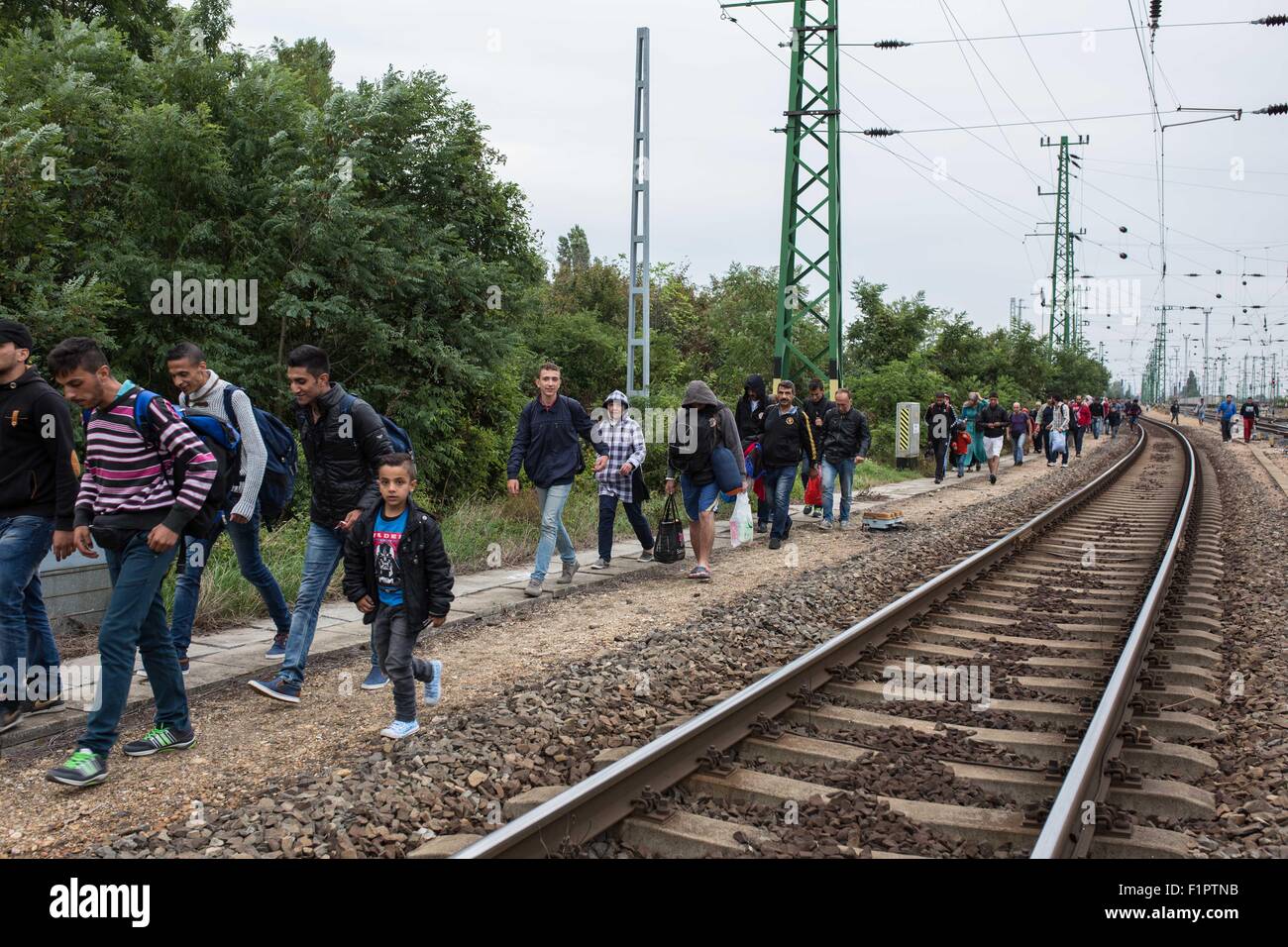 Hegyeshalom, Hungary. 5th September, 2015. Refugees walk along the ...