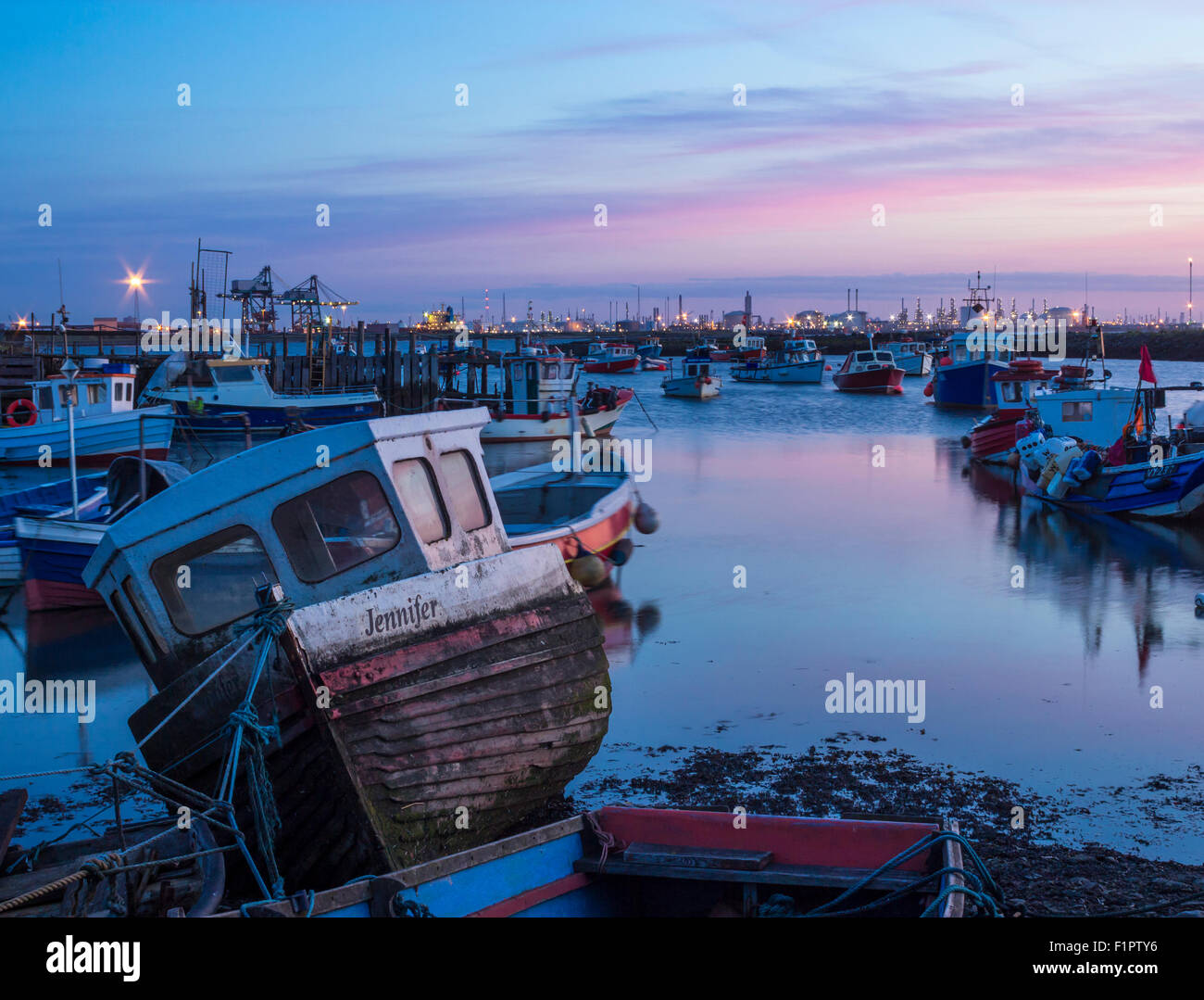 Fishing boats at sunset at the South Gare, Tees estuary, Teesmouth at ...