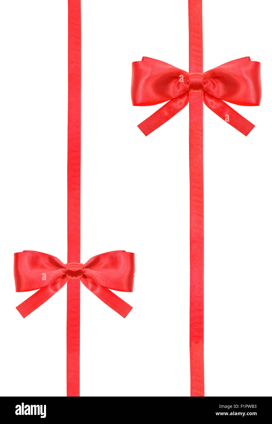 two red satin bows and two vertical ribbons isolated on vertical white ...