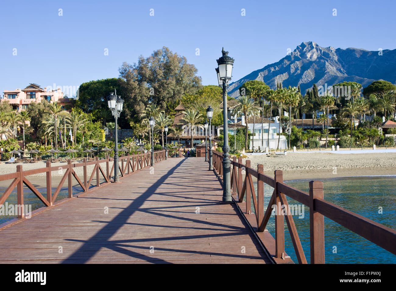 Pier, beach and sea in resort city of Marbella in Spain, Costa del Sol ...