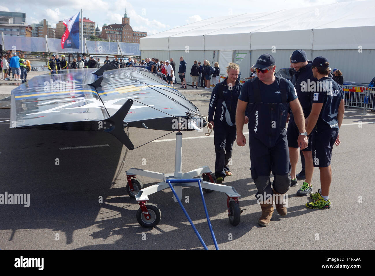 Artemis Amerisa's Cup team inspecting wing sail of their racing boat a ...