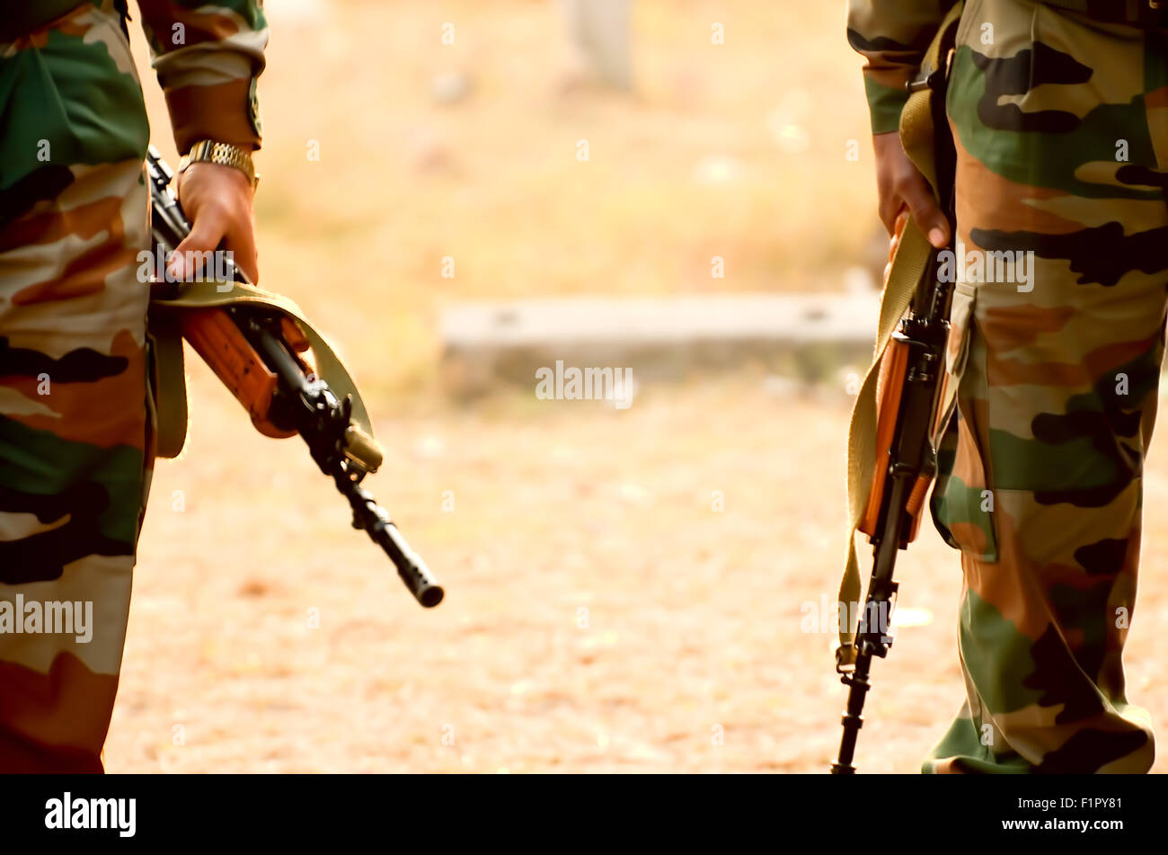 Soldier hiding AK-47 Stock Photo - Alamy