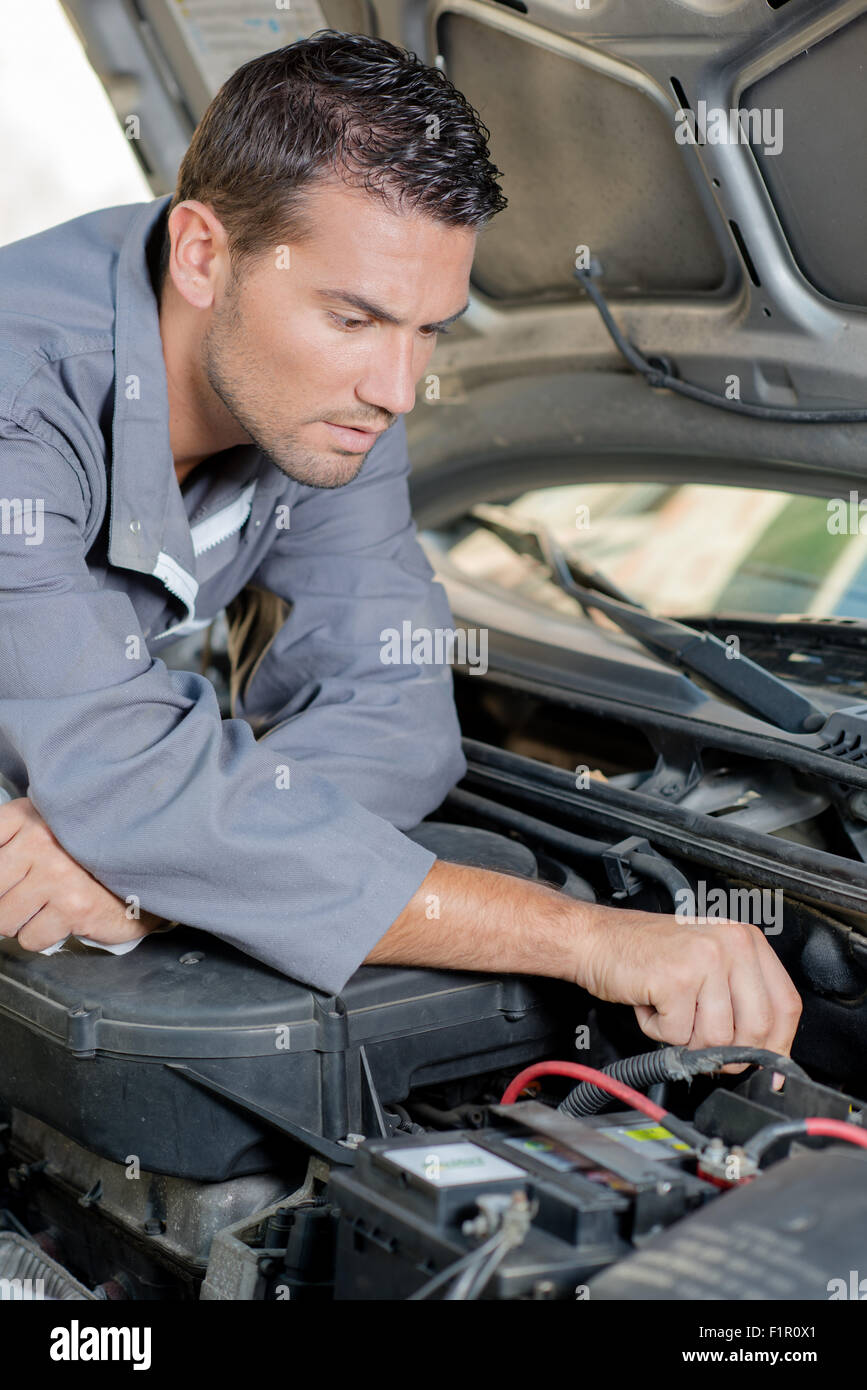 mechanic working on engine Stock Photo - Alamy