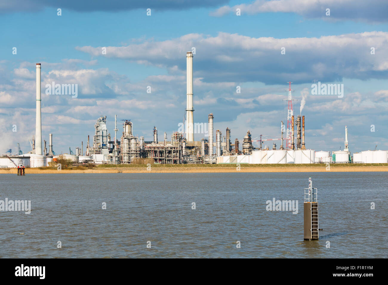 A large oil refinery with oil storage tanks in the port of Antwerp ...