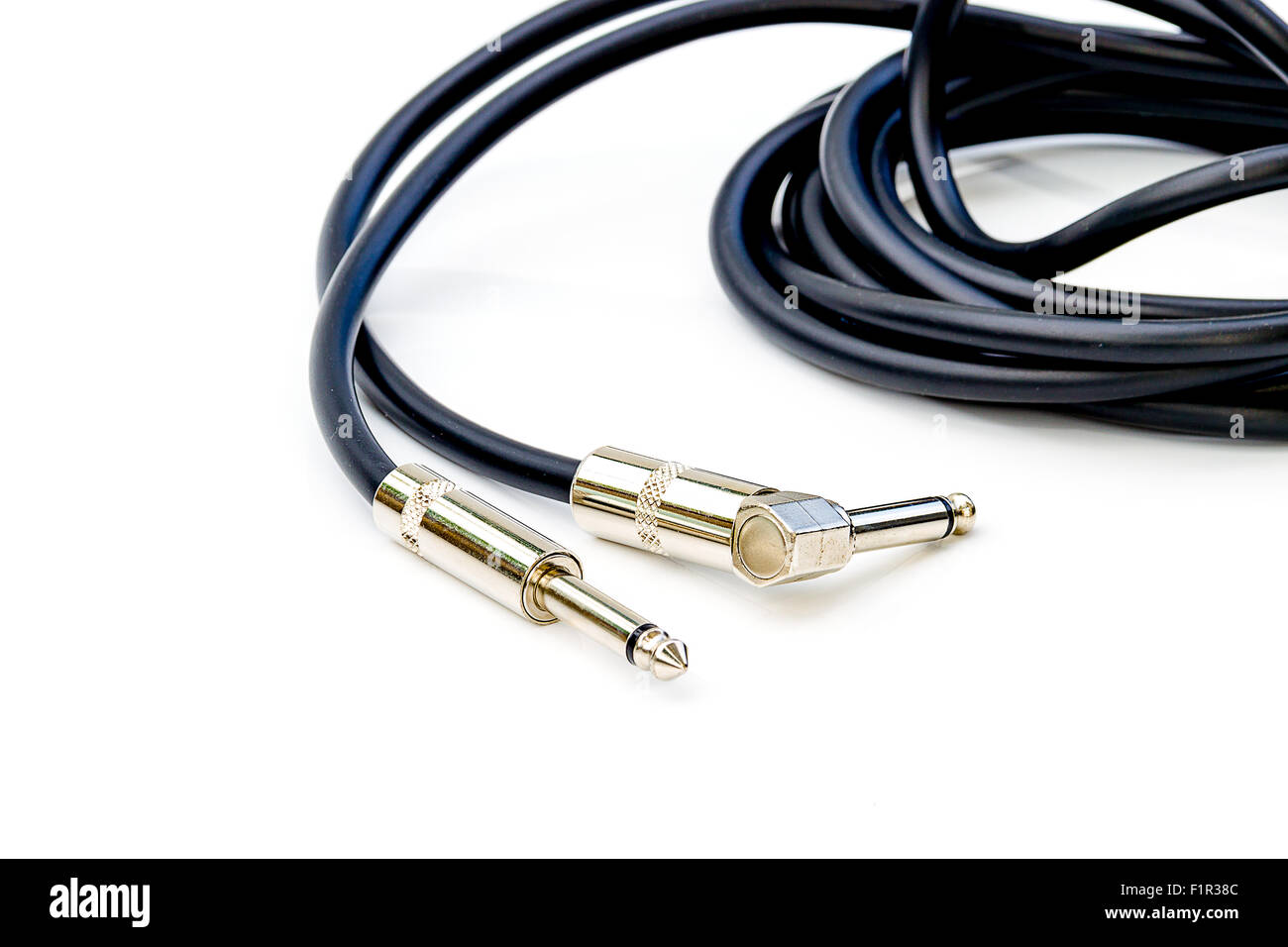 guitar cable on white table Stock Photo - Alamy