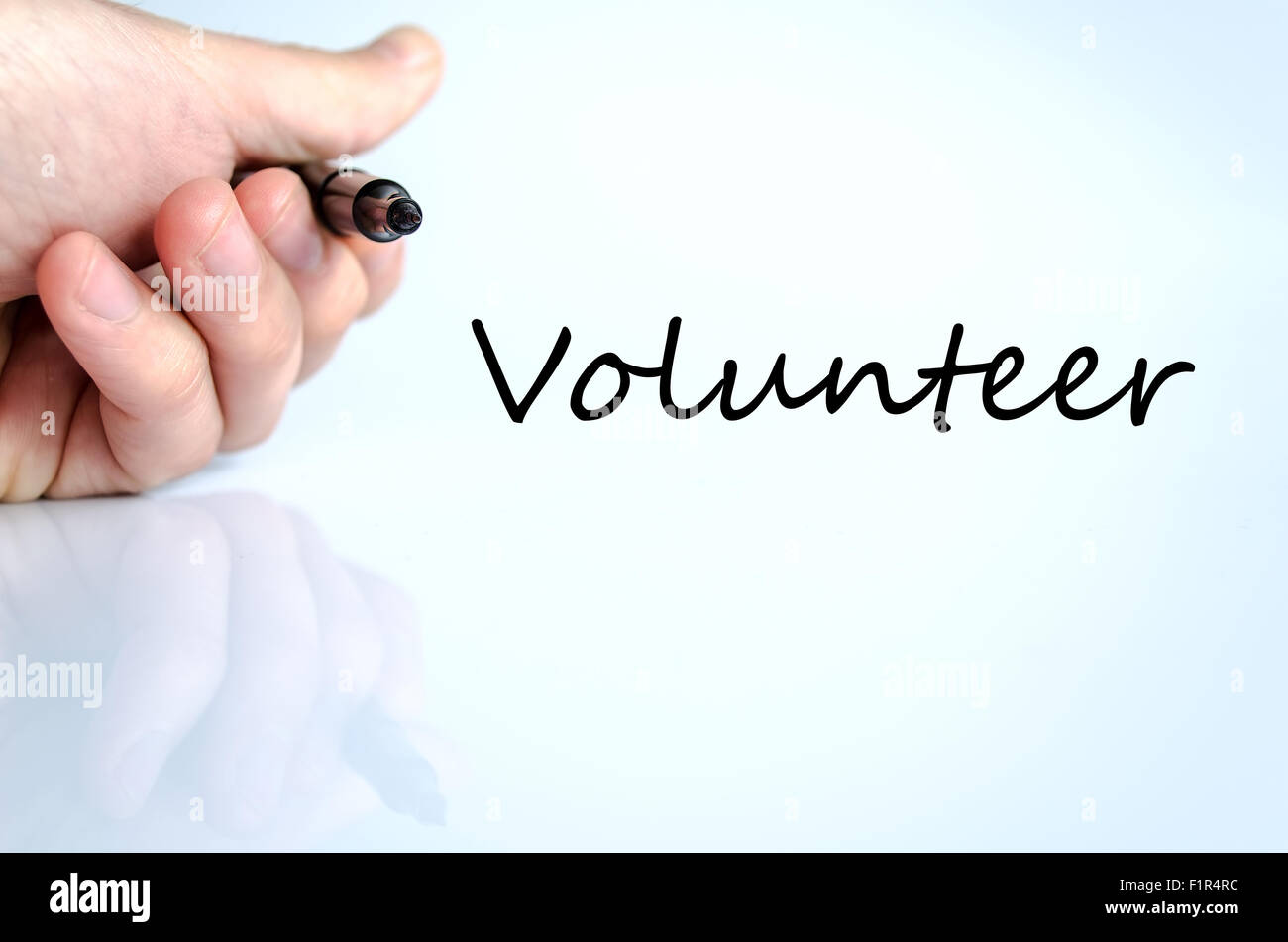 Volunteer text concept isolated over white background Stock Photo - Alamy
