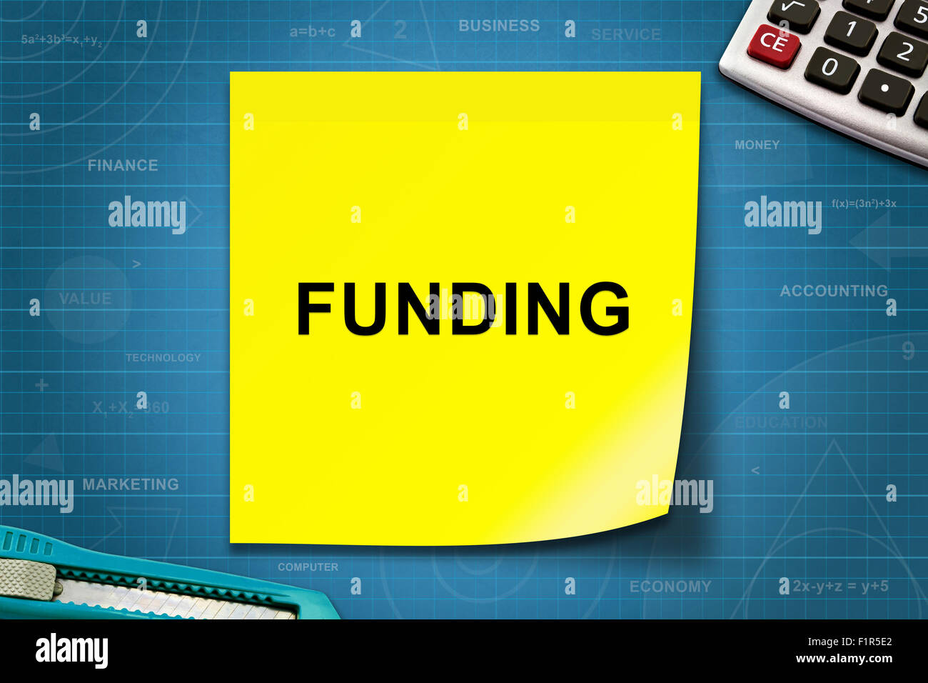 Funding text on yellow note with graph paper Stock Photo - Alamy
