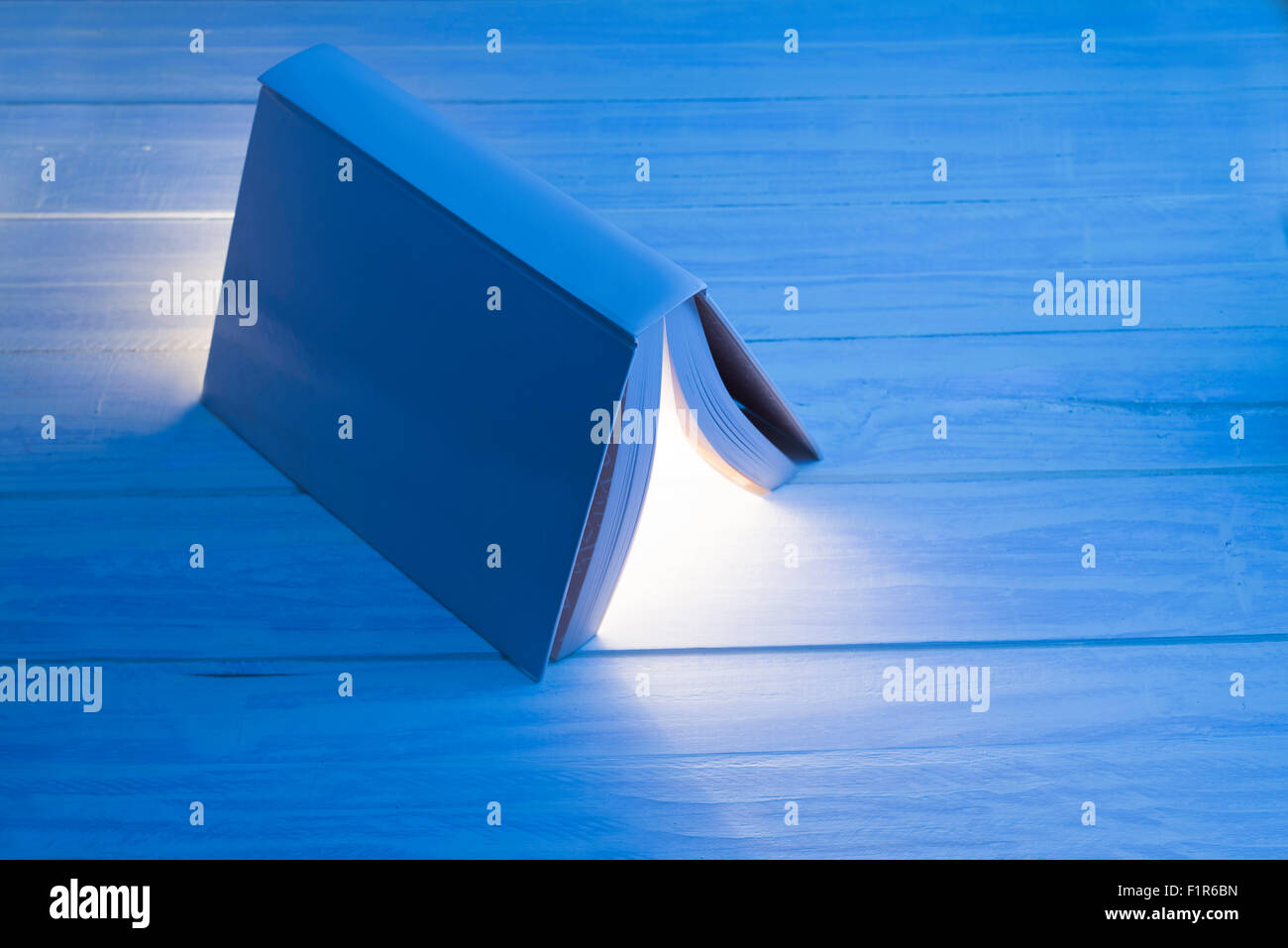 Magic open book. Education concept Stock Photo - Alamy