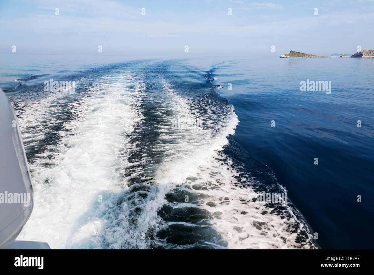 Sunset waves behind boat hi-res stock photography and images - Alamy