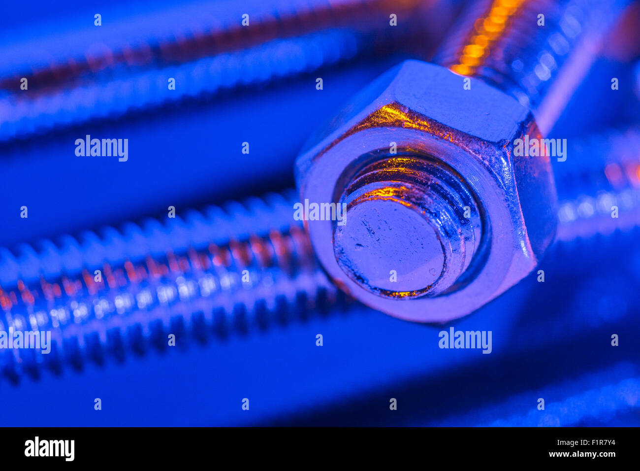 Nut and bolt, taken under artificial lighting. Macro-photo Stock Photo ...