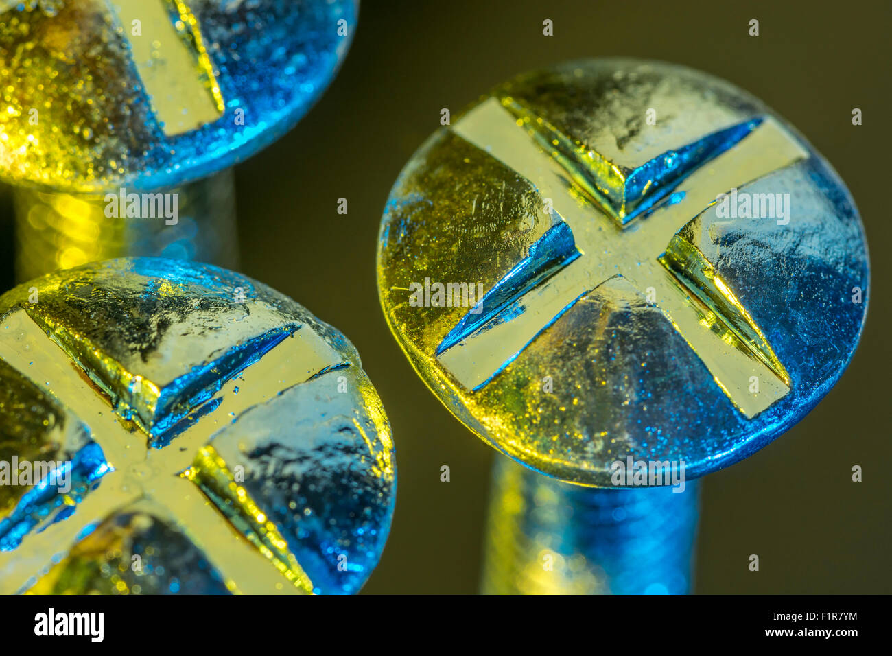 Set of bolt heads taken under artificial lighting. Macro-photo Stock ...