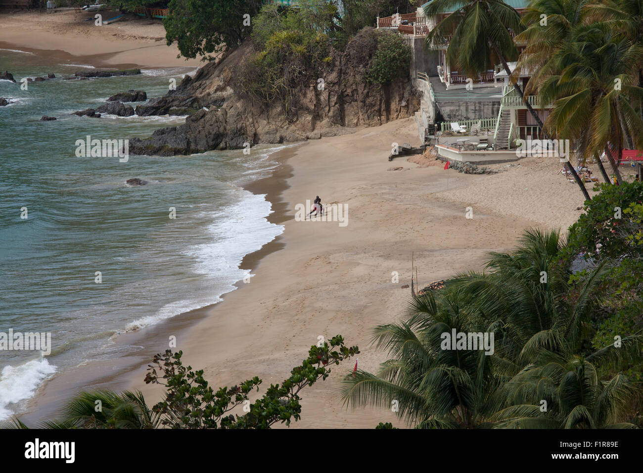 Two athletic fishermen practicising their lunges on the beach at Little ...
