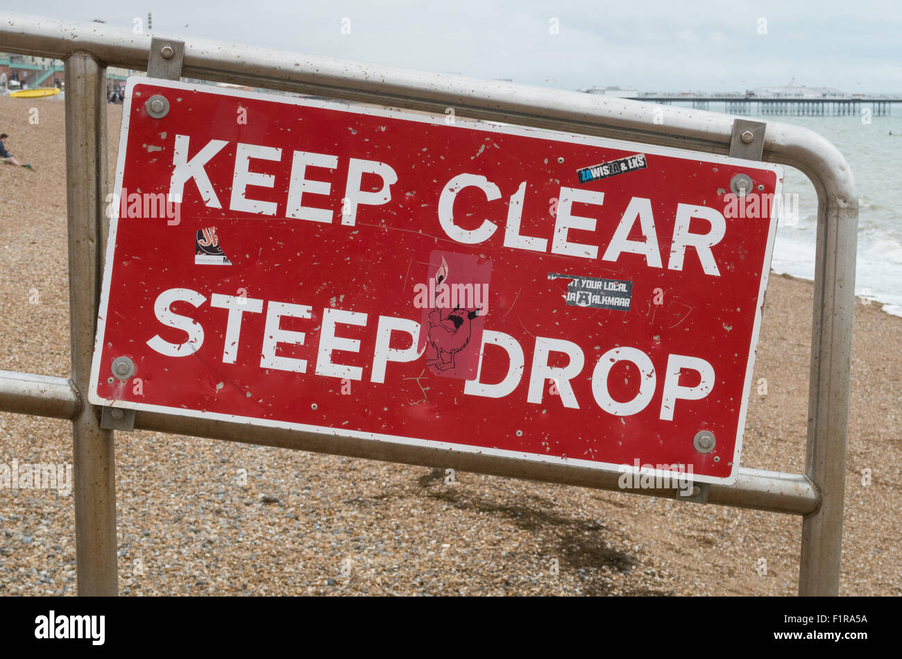 Keep Clear Steep Drop sign on Brighton Beach Stock Photo - Alamy