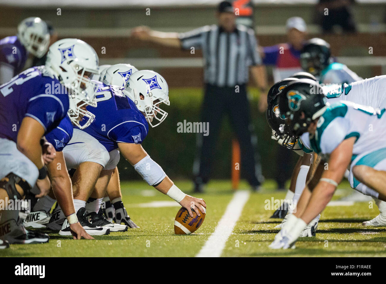 The Furman offensive line faces off against Coastal Carolina during the ...