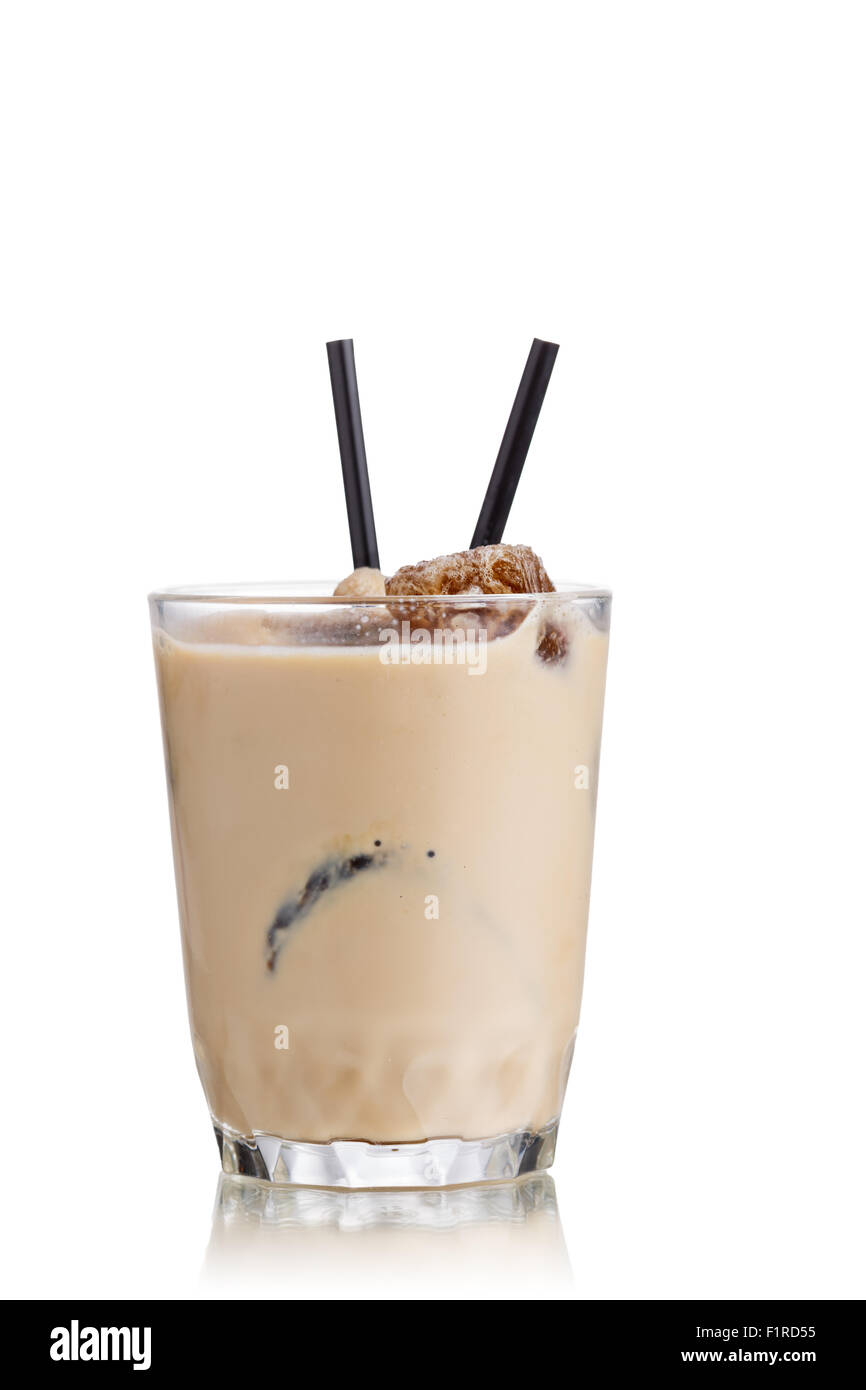 Milk coffee cocktail from frozen coffee cubes in highball glass. Iced ...
