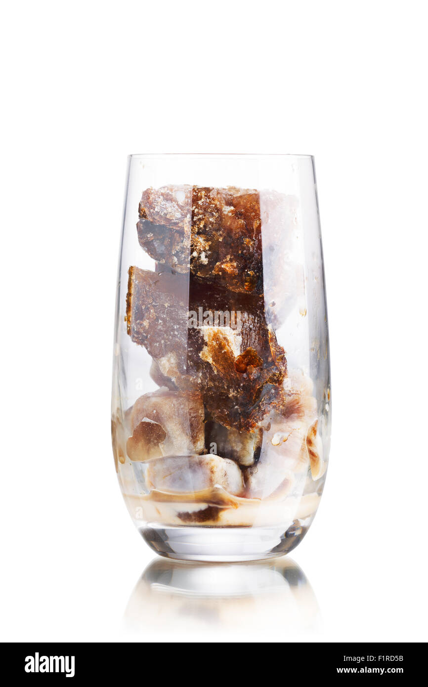 Milk coffee cocktail from frozen coffee cubes in highball glass. Iced ...